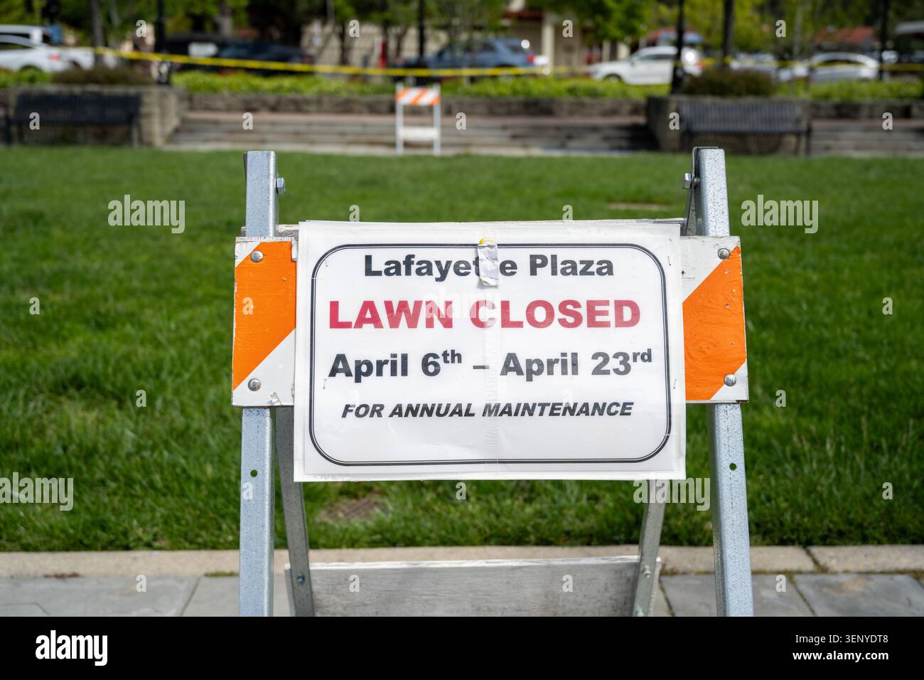 Lawn area with temporary closure sign at Lafayette Plaza Park ...