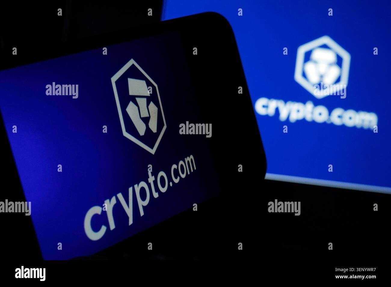 FILE - The logo for crypto.com appears on a mobile phone and computer ...
