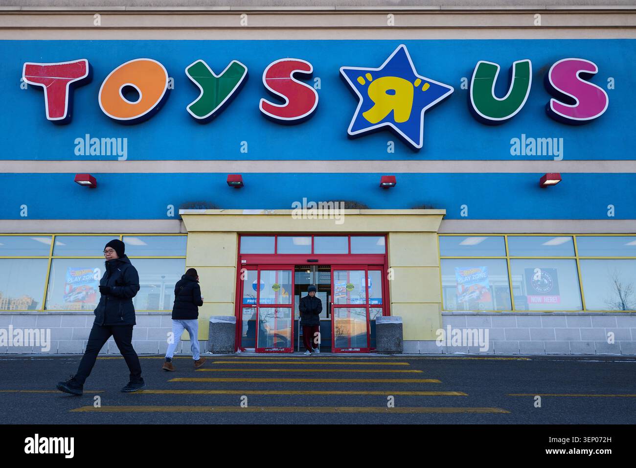 Shoppers exit a Toys 'R' Us store in Vaughan, Ont., on Wednesday, Feb ...