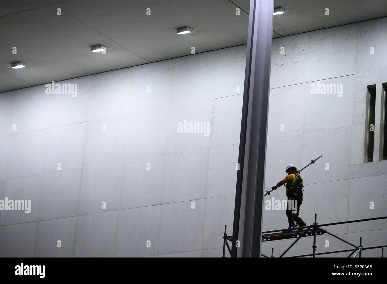 A worker helps build scaffolding at the John F. Kennedy Center for the ...