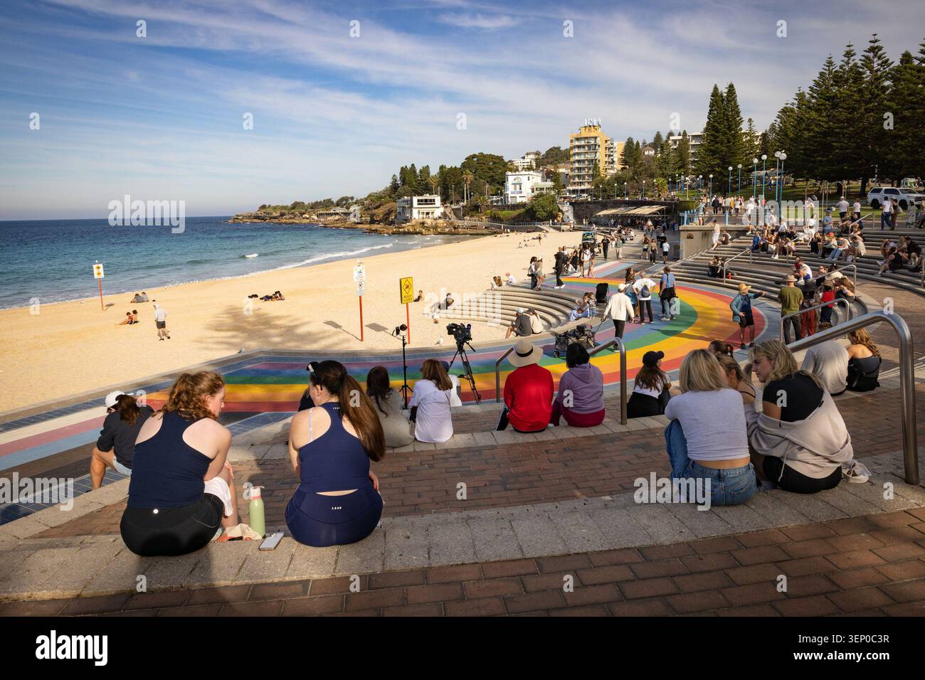 People sit on stairs at Coogee beach following a shark attack in Sydney ...