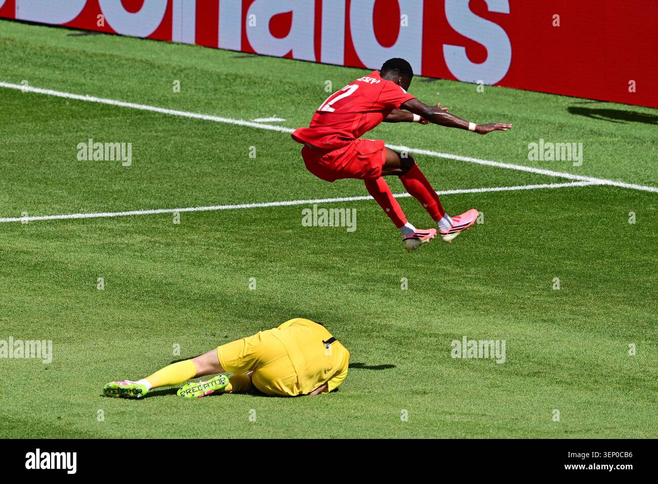 Canada's Tani Oluwaseyi (12) jumps over Bosnia and Herzegovina's Nikola ...