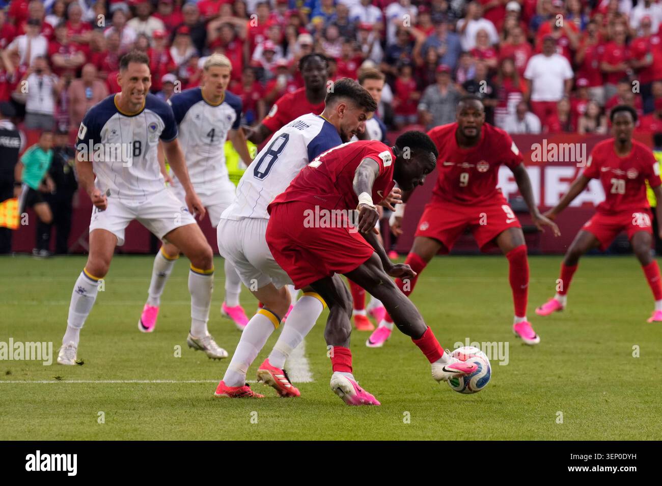 Canada's Richie Laryea (22) tries to pass under pressure from Bosnia ...