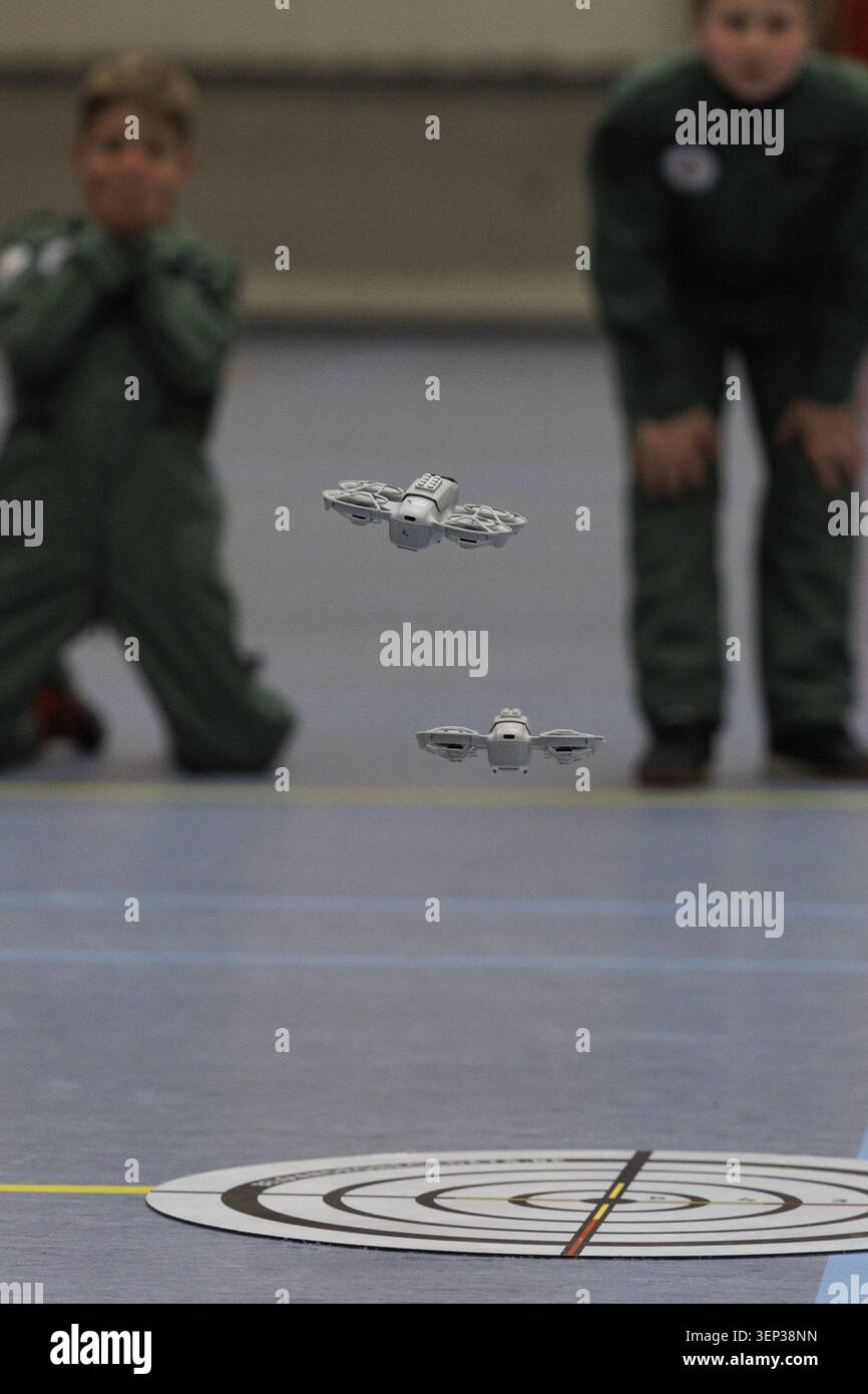 Kids learn to operate a drone whilst playing pictured during a 'drone ...