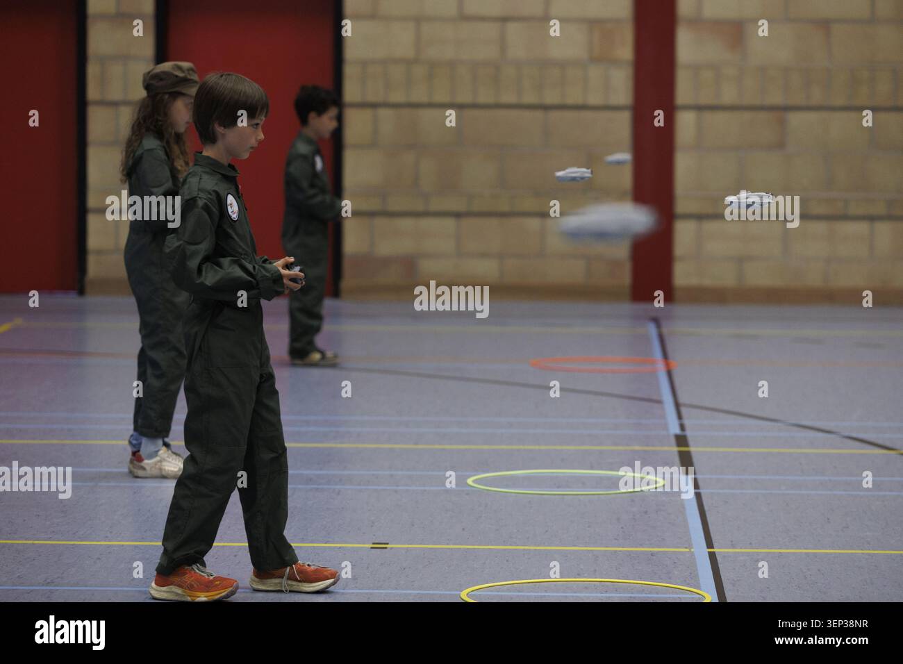 Kids learn to operate a drone whilst playing pictured during a 'drone ...