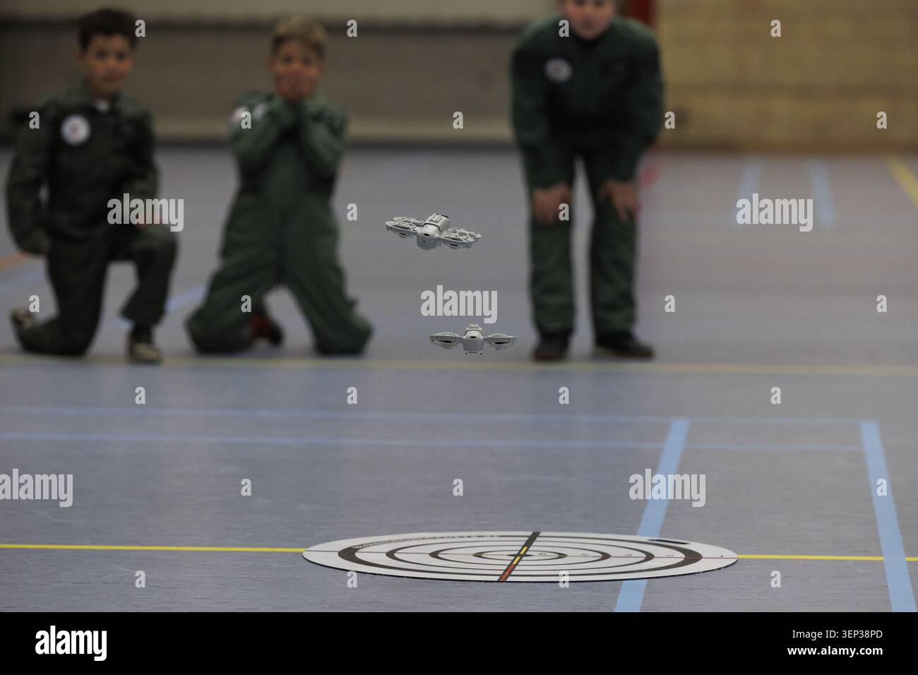 Kids learn to operate a drone whilst playing pictured during a 'drone ...
