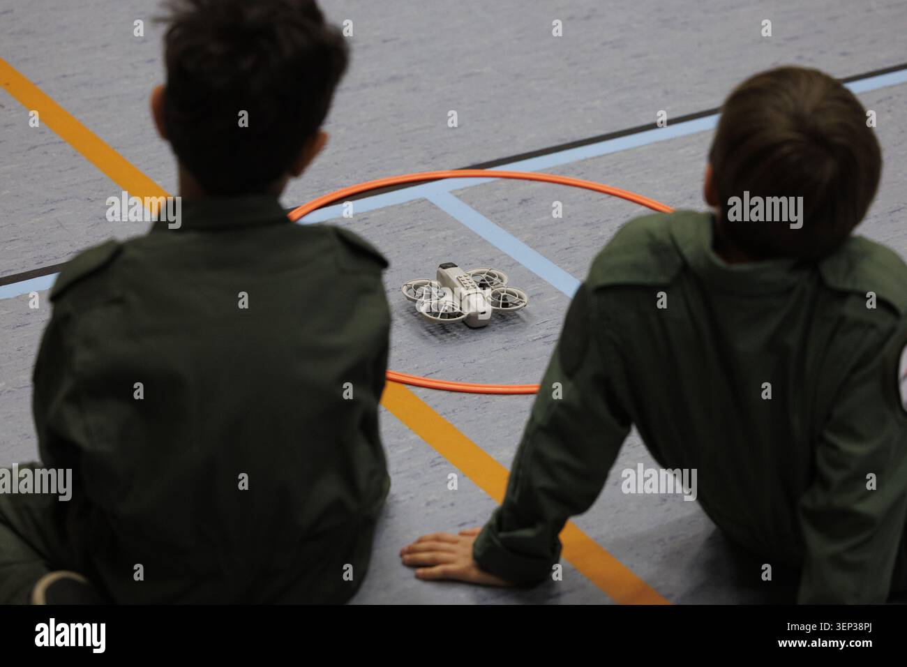 Kids learn to operate a drone whilst playing pictured during a 'drone ...