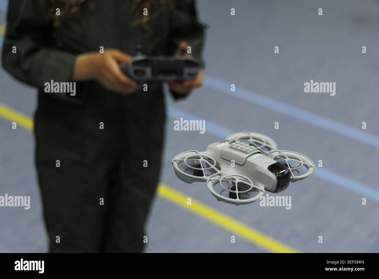 Kids learn to operate a drone whilst playing pictured during a 'drone ...