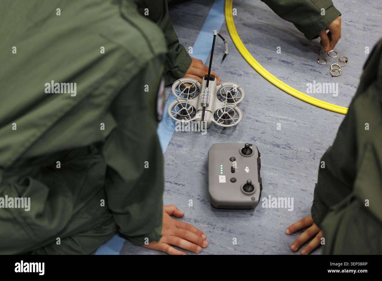 Kids learn to operate a drone whilst playing pictured during a 'drone ...