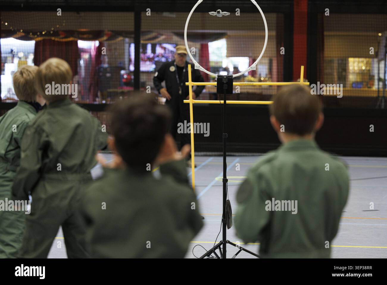 Kids learn to operate a drone whilst playing pictured during a 'drone ...