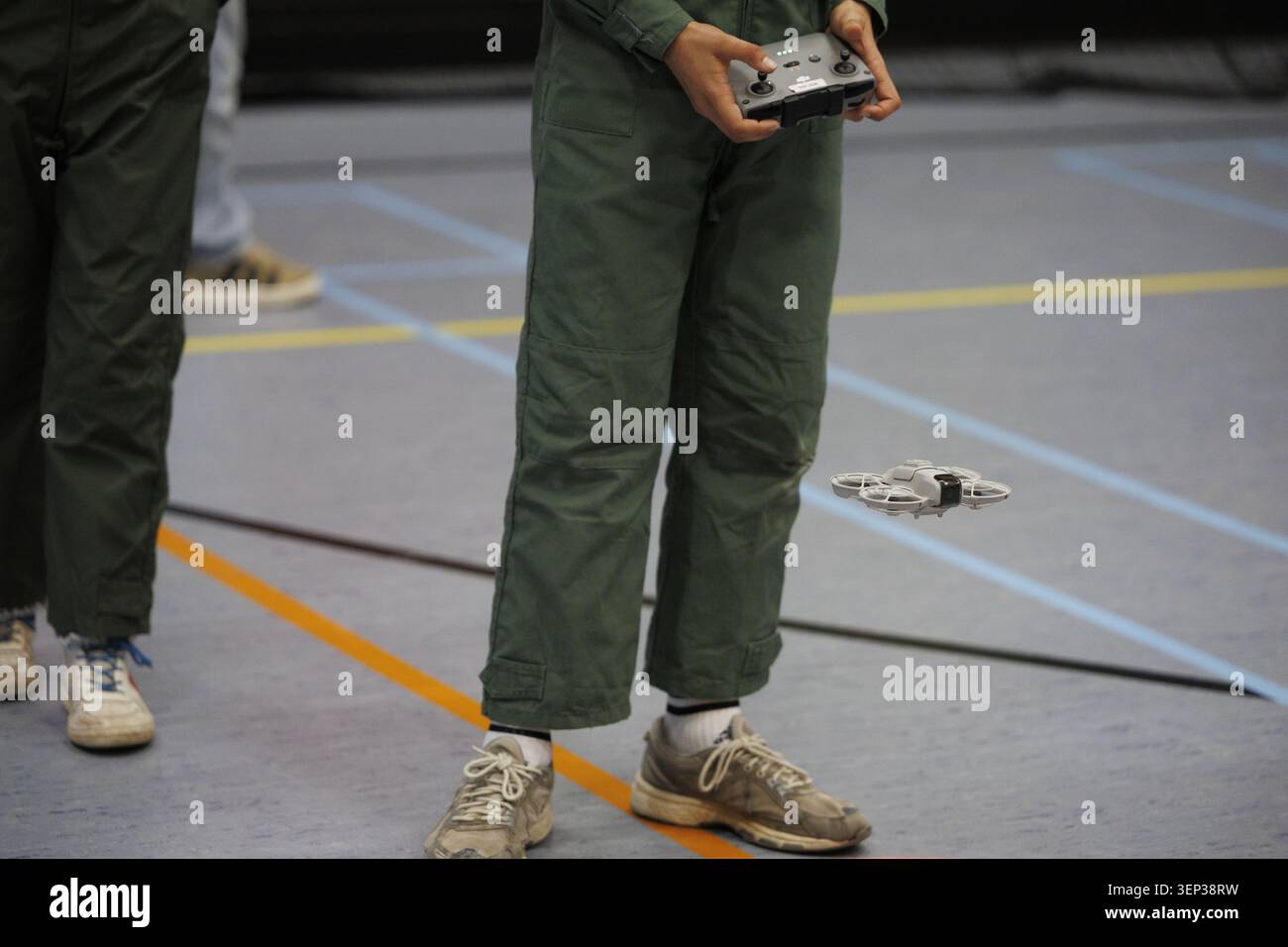 Kids learn to operate a drone whilst playing pictured during a 'drone ...