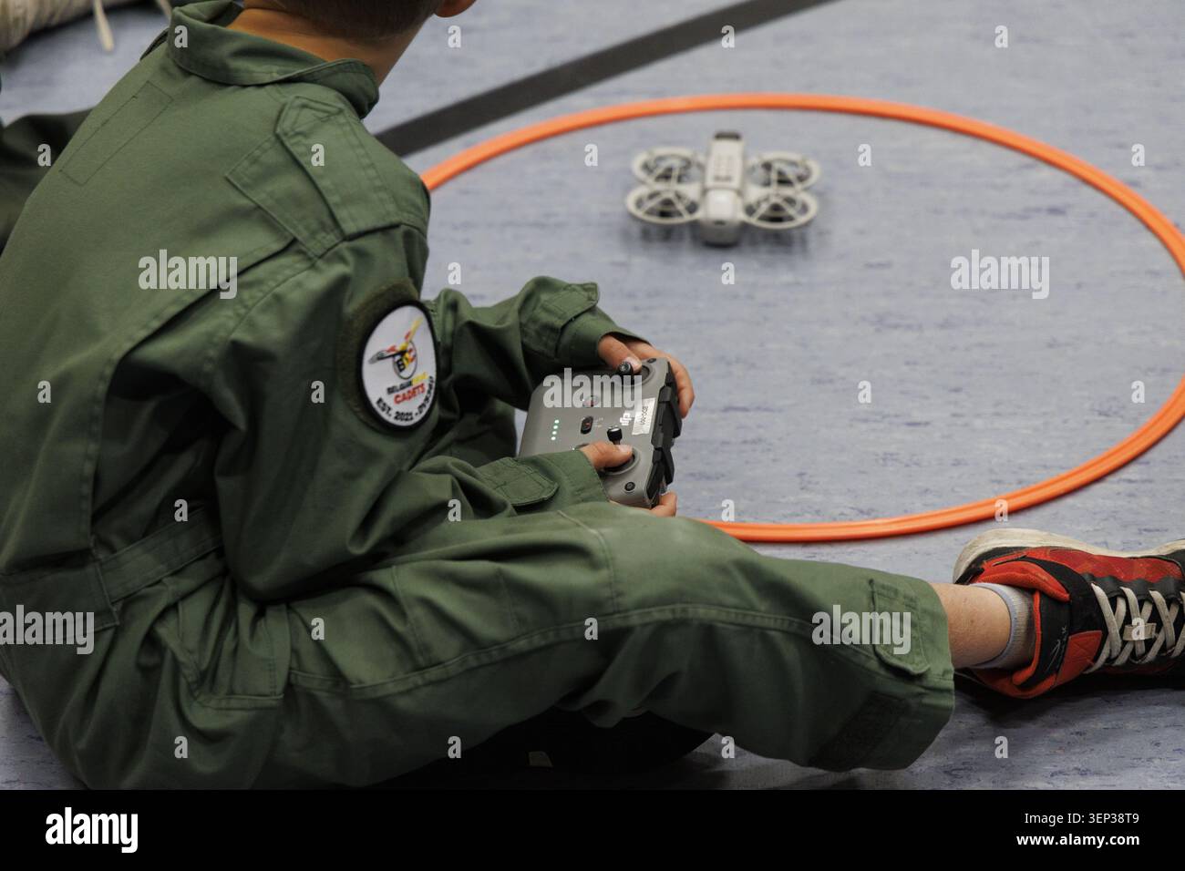Kids learn to operate a drone whilst playing pictured during a 'drone ...