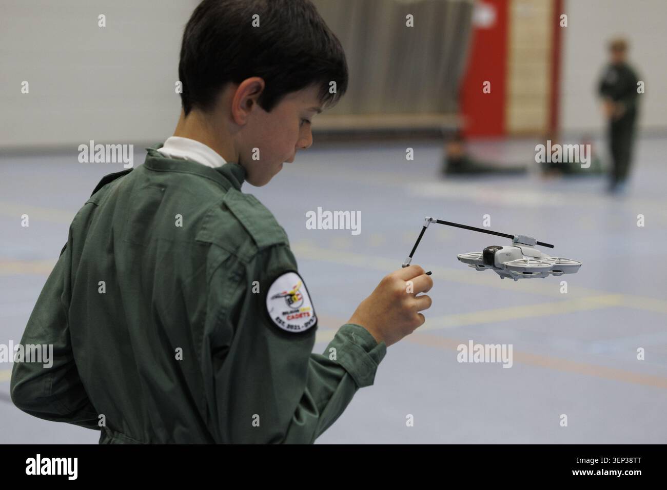 Kids learn to operate a drone whilst playing pictured during a 'drone ...