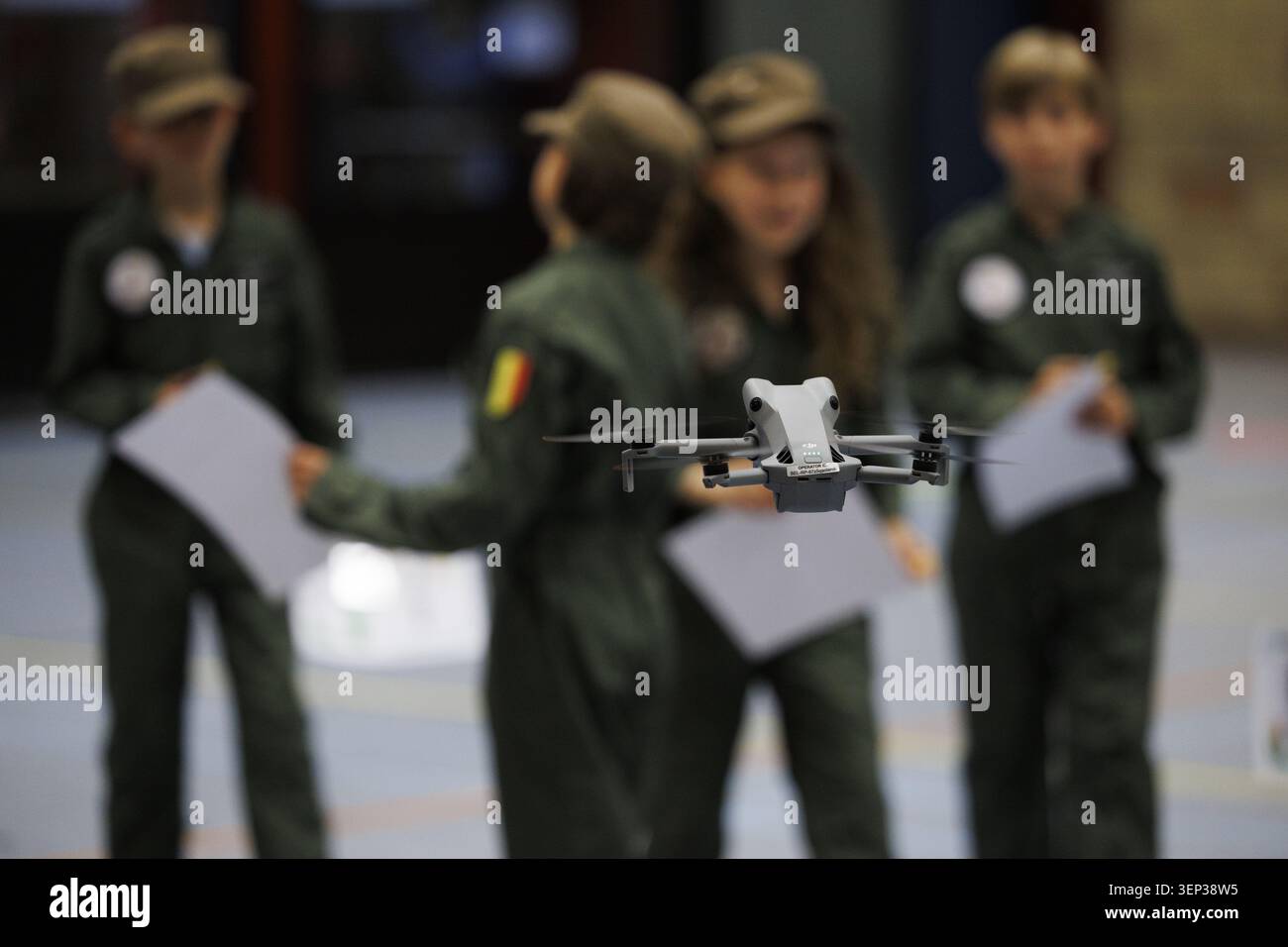 Kids learn to operate a drone whilst playing pictured during a 'drone ...