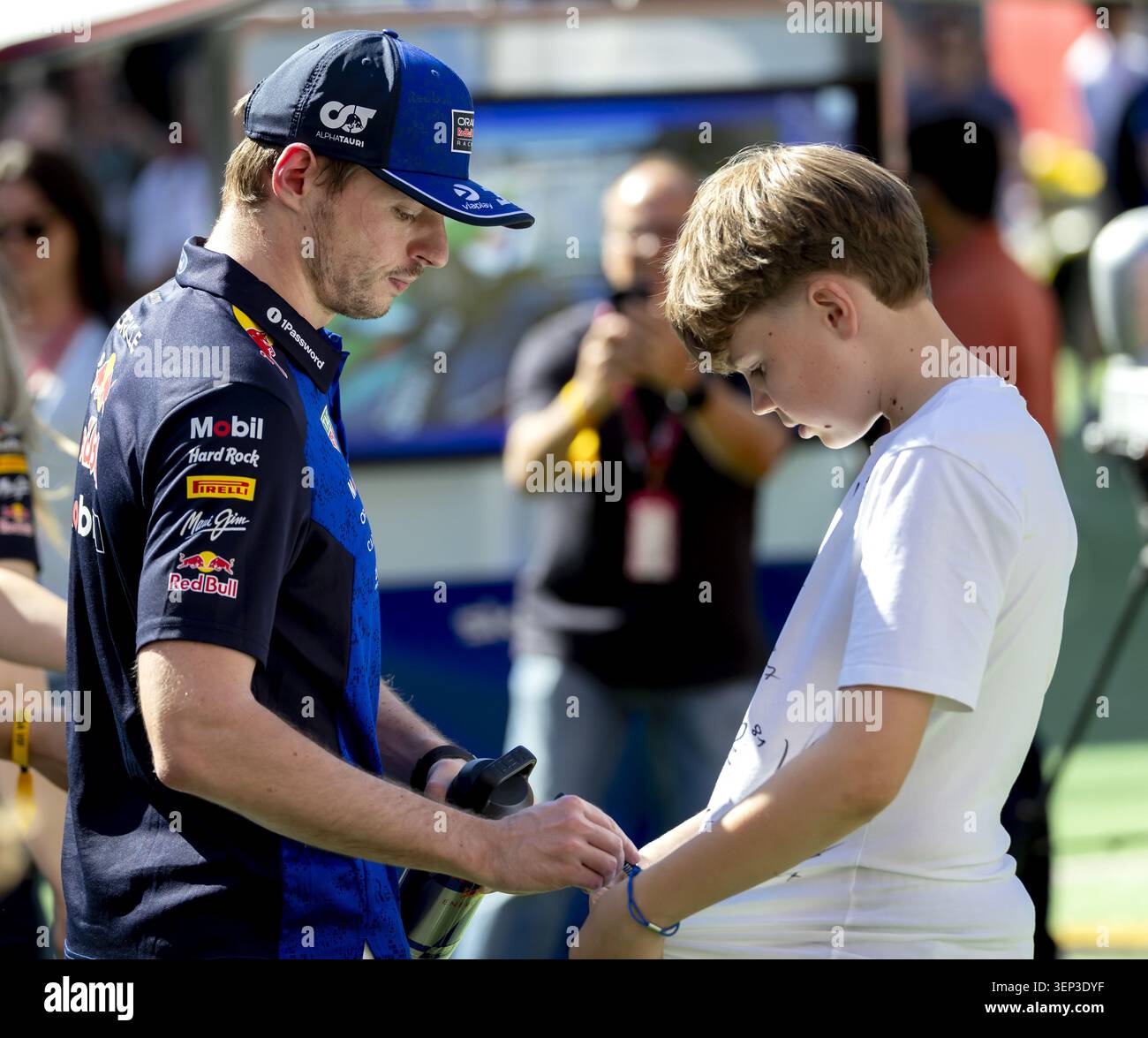 BARCELONA - Max Verstappen signs a fan's shirt after qualifying for the ...