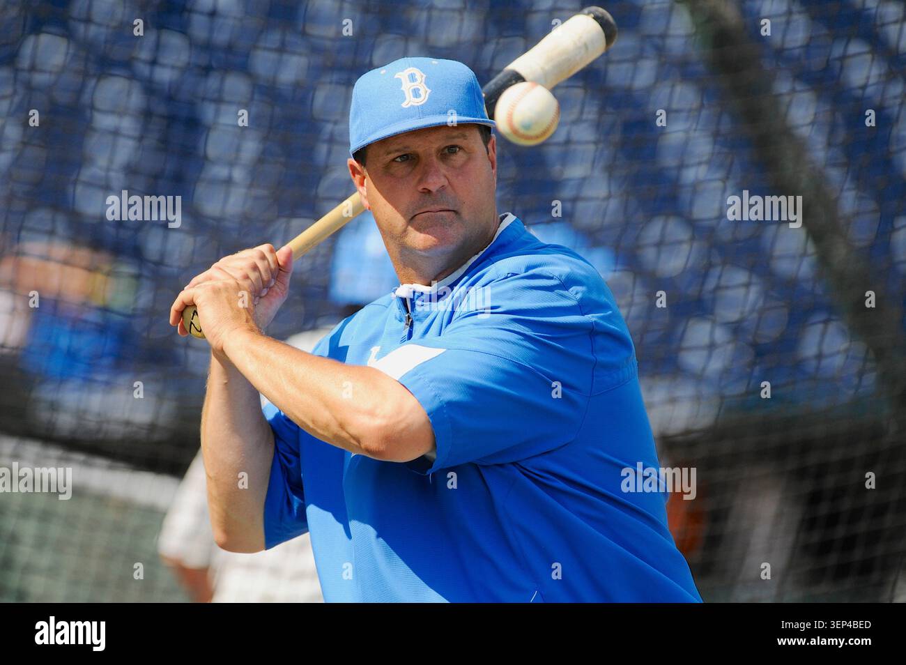 FILE - UCLA coach John Savage eyes the ball during NCAA college ...
