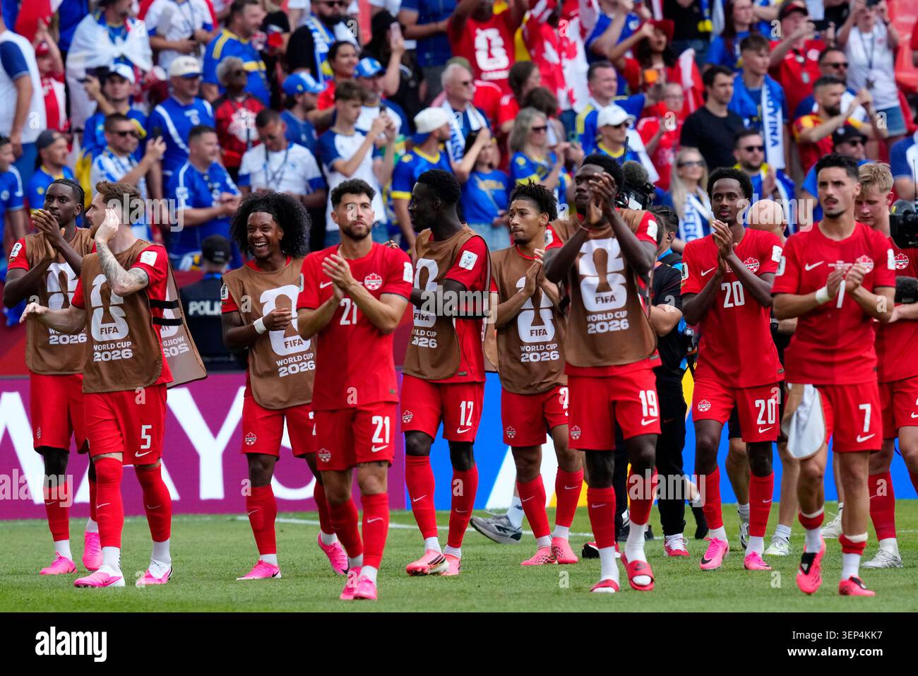 Canada players salute the crowd following a World Cup soccer game ...