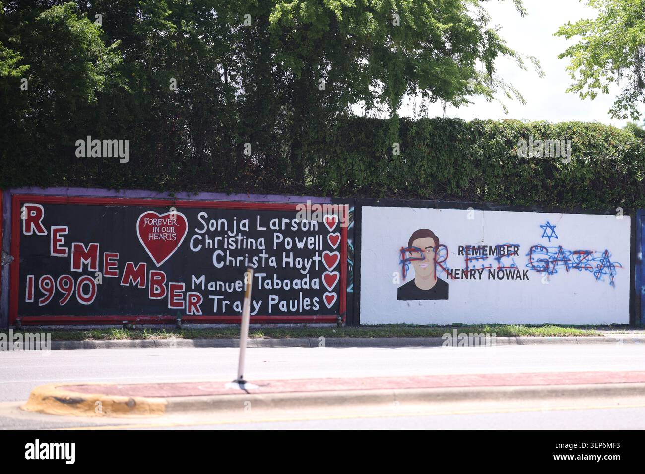 A mural to British murder victim Henry Nowak is defaced with both "Free ...