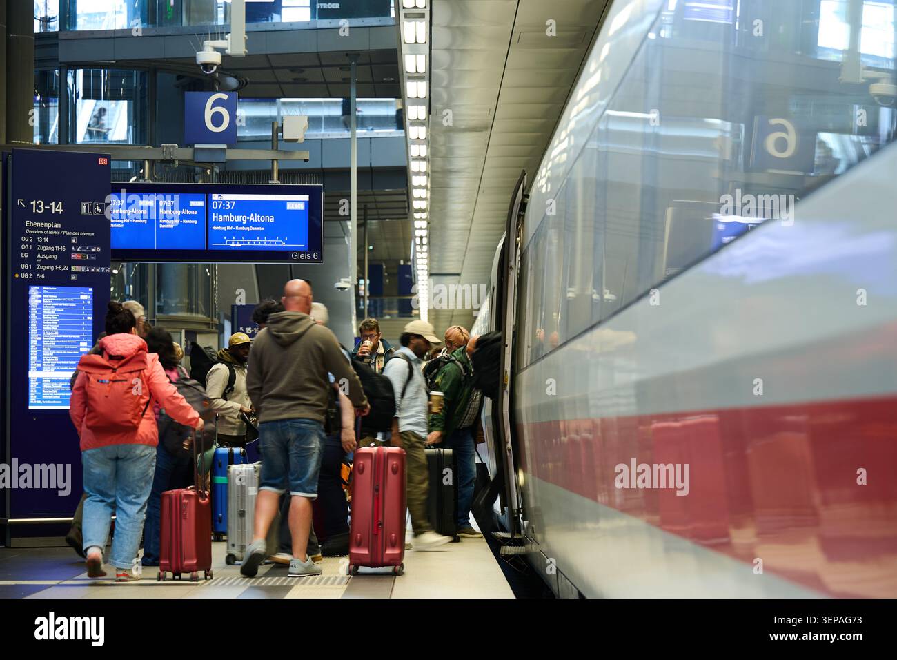 14 June 2026, Berlin: People are boarding the ICE at Berlin Central ...