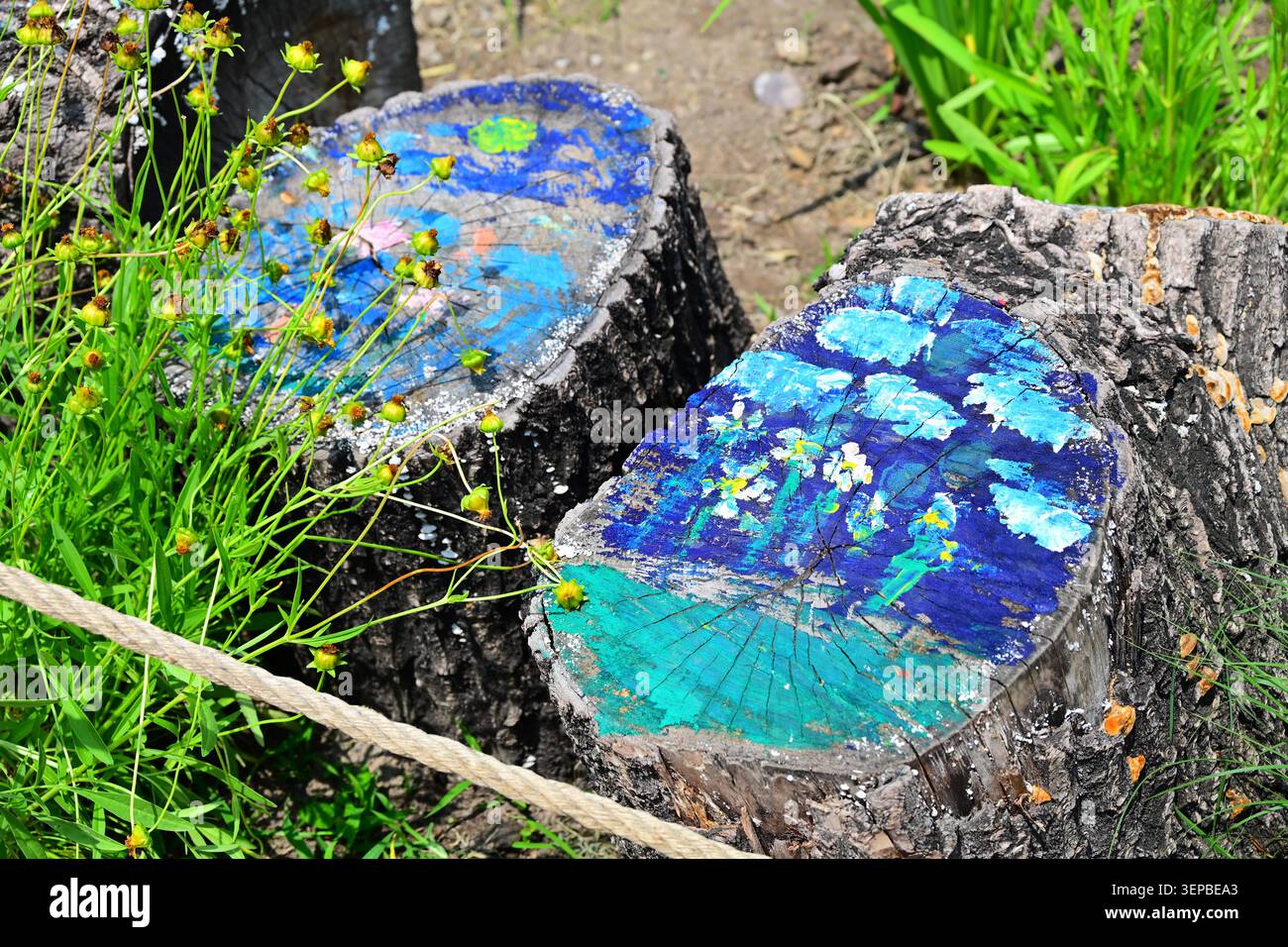 Vibrant cartoon paintings adorn withered tree trunks at Lotus Pond Park ...