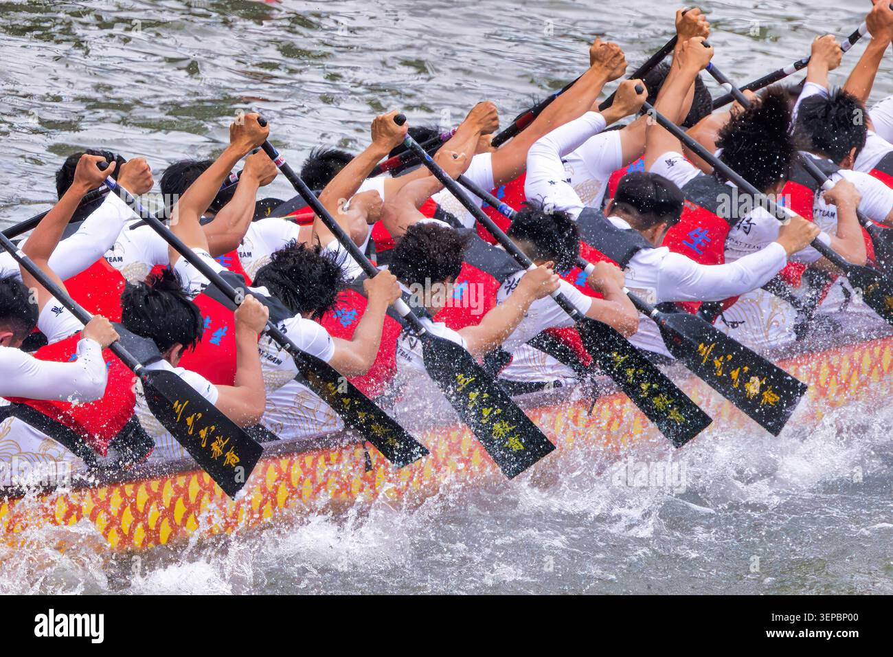 Competitors race during the 2026 Suzhou River Dragon Boat Invitational ...