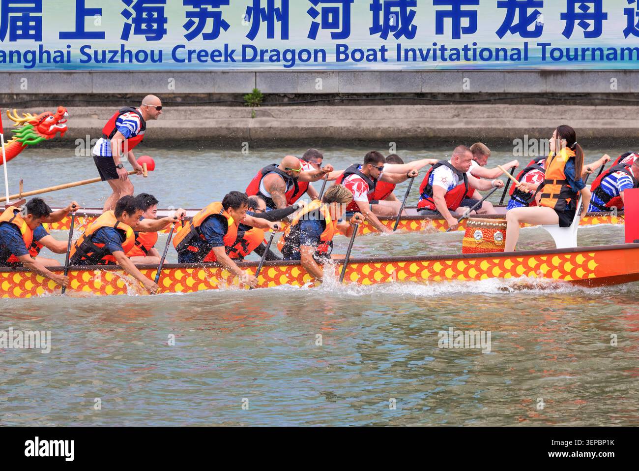 Competitors race during the 2026 Suzhou River Dragon Boat Invitational ...