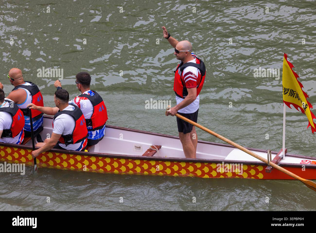 Members of the Russian Vladivostok team compete during the Suzhou River ...