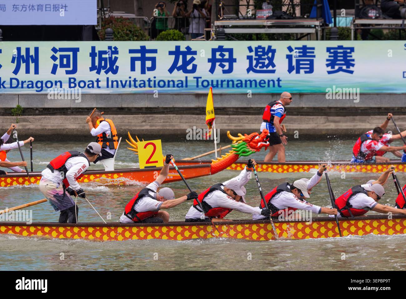 Competitors race during the 2026 Suzhou River Dragon Boat Invitational ...