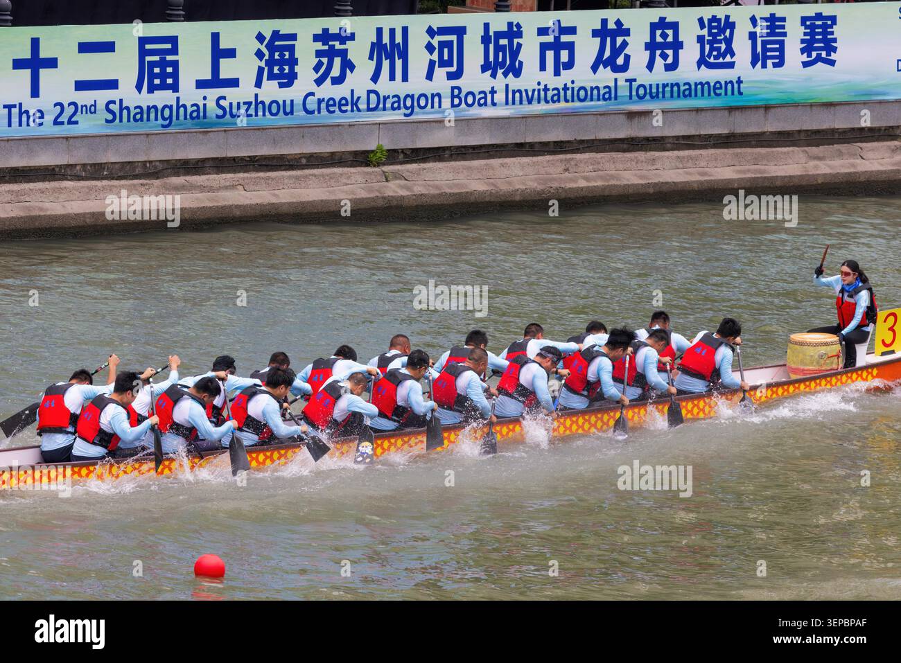 Competitors race during the 2026 Suzhou River Dragon Boat Invitational ...