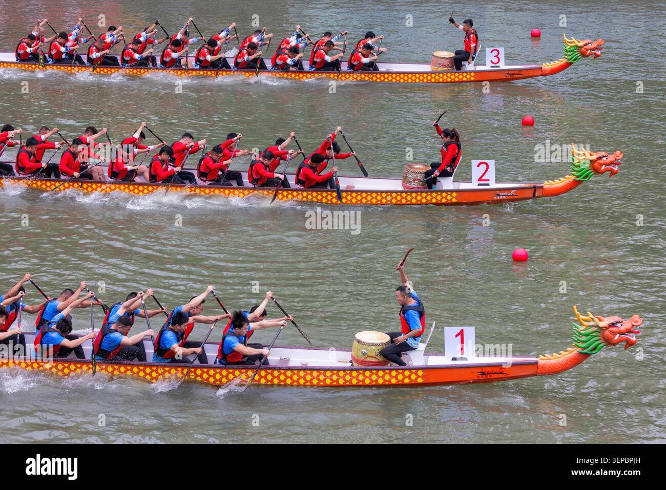 Competitors race during the 2026 Suzhou River Dragon Boat Invitational ...