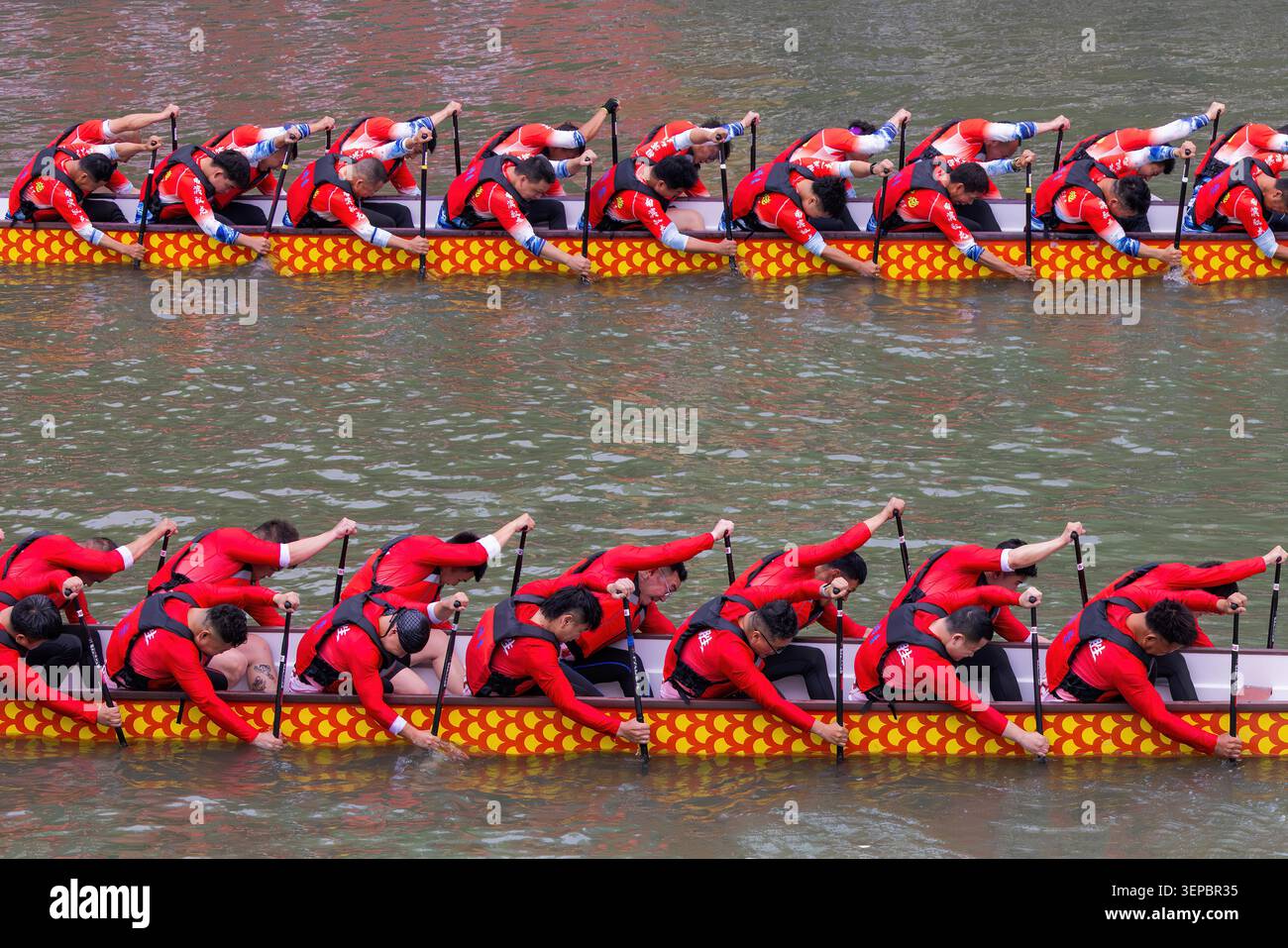 Competitors race during the 2026 Suzhou River Dragon Boat Invitational ...