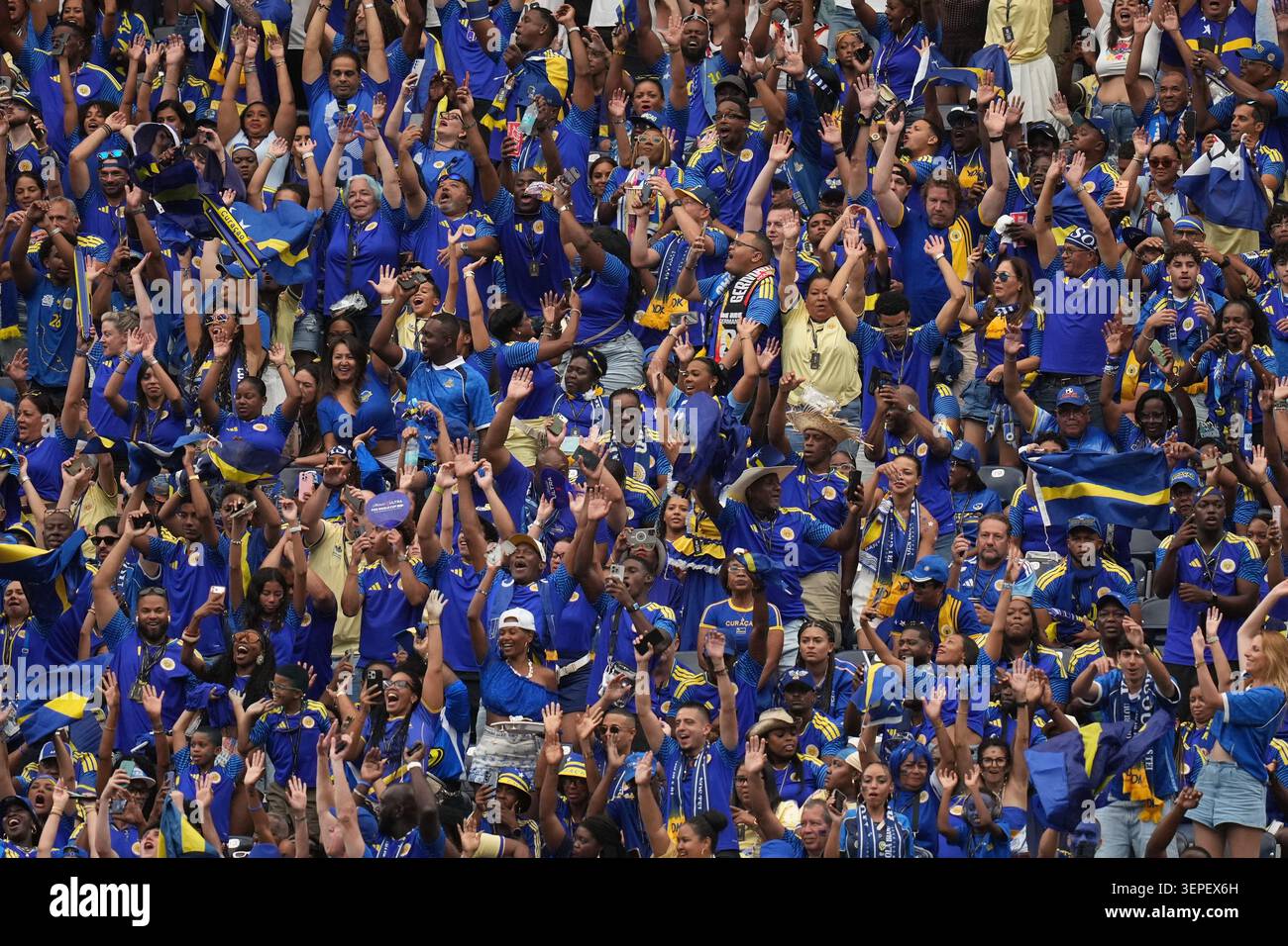 Curacao fans make a wave during the World Cup Group E soccer match ...