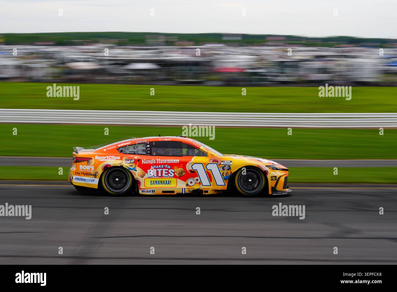 Denny Hamlin drives during a NASCAR Cup Series auto race at Pocono ...