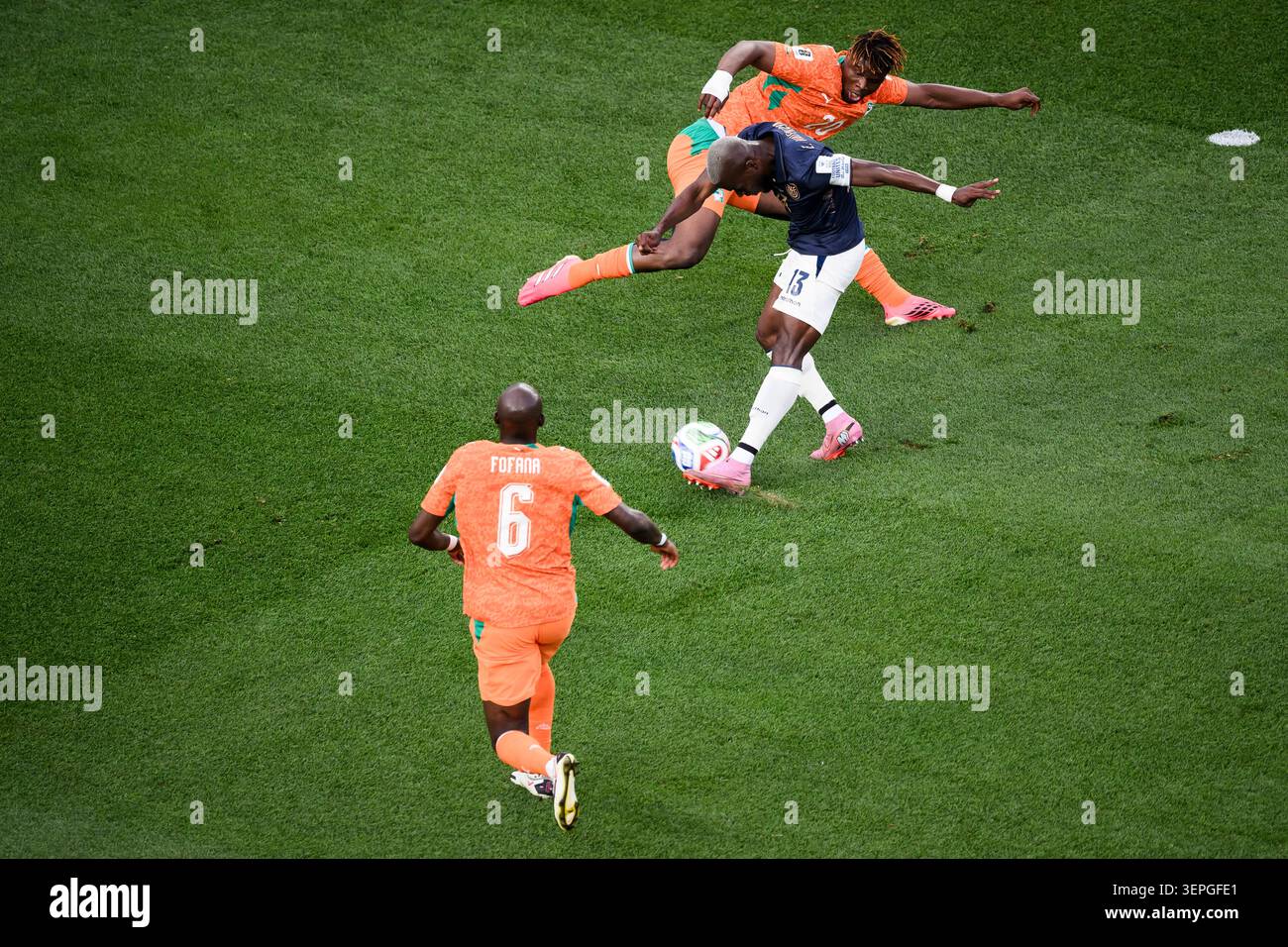Enner Valencia of Ecuador cimpetes for the ball with Emmanuel Agbadou ...