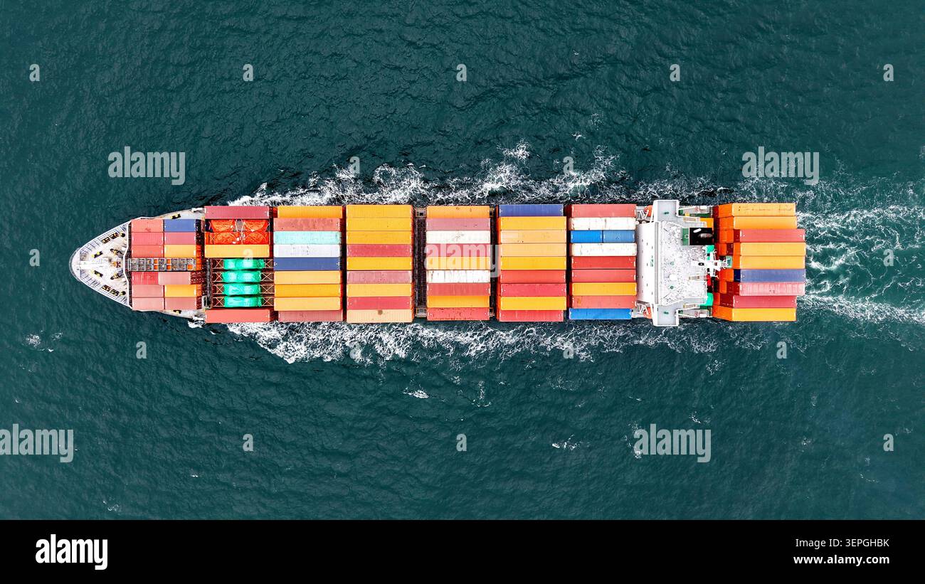 A container ship departs the port in Qingdao in eastern China's ...