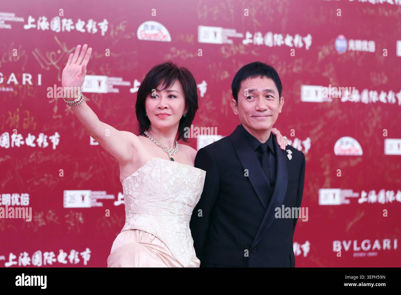 Chinese actor Tony Leung and his wife Carina Lau walk the red carpet ...