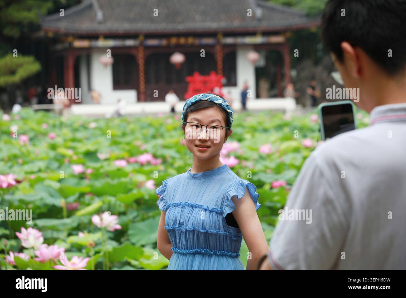Visitors take photos of lotus blossoms at Mochou Lake Park in Nanjing ...