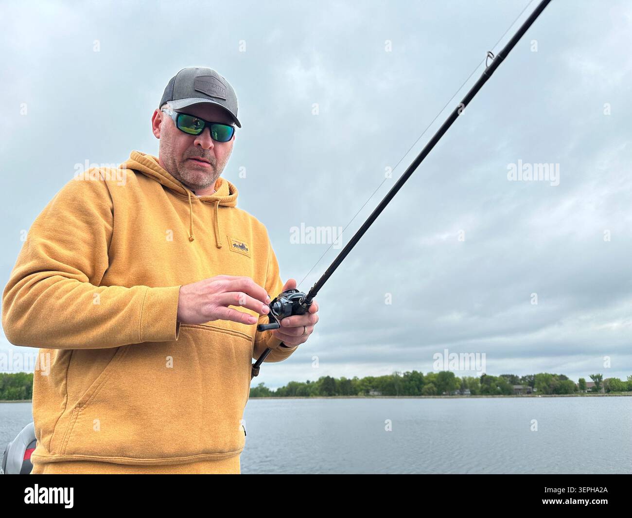 Terry Rehm casts for fish Saturday, May 23, 2026 in Nowthen, Minn. (AP ...