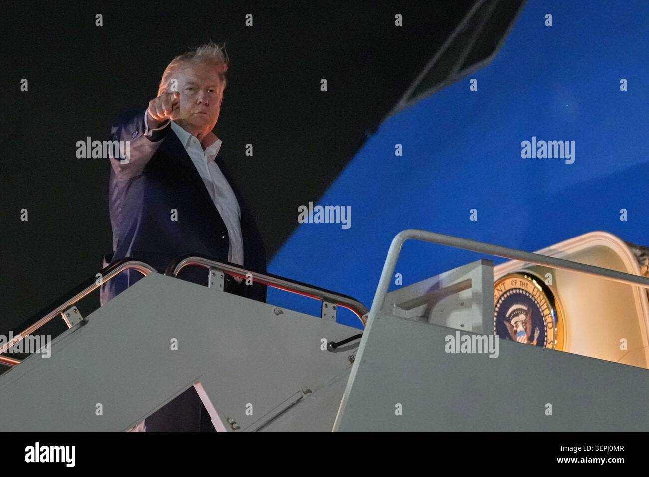 President Donald Trump points as he boards Air Force One, Monday, June ...