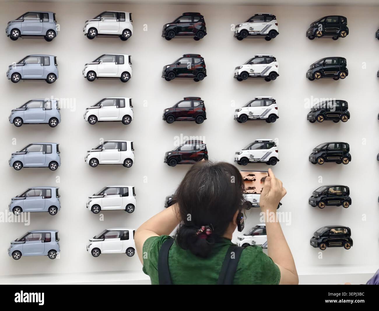 Visitors observe new energy vehicle models at SGMW Baojun Base in ...