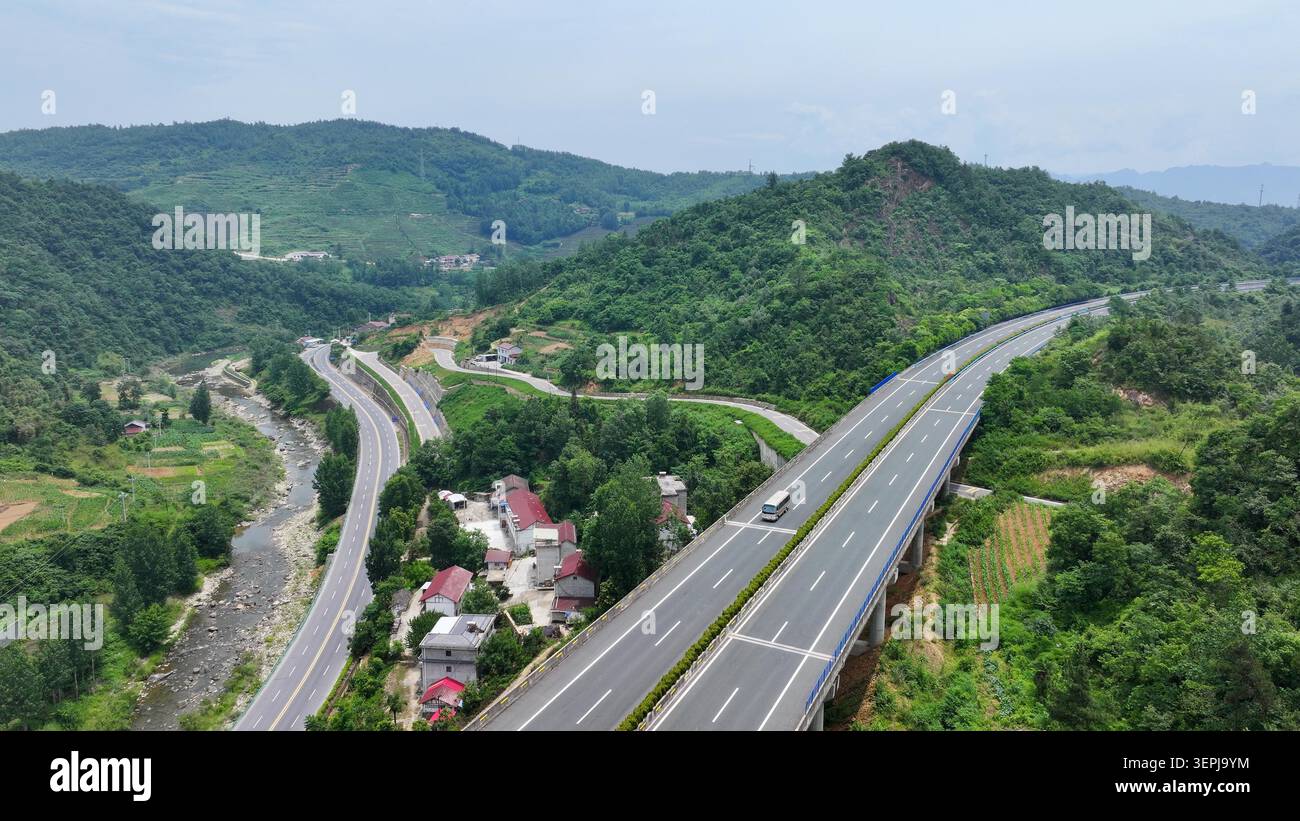 A winding road connects Guahuaping Village in Hongta Town to downtown ...