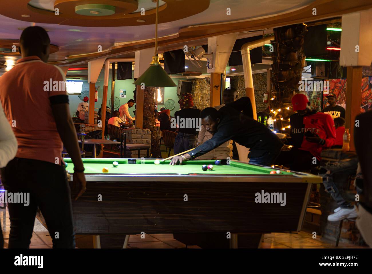Customers play pool at the Miterants nightclub in Bunia, Congo, Sunday ...