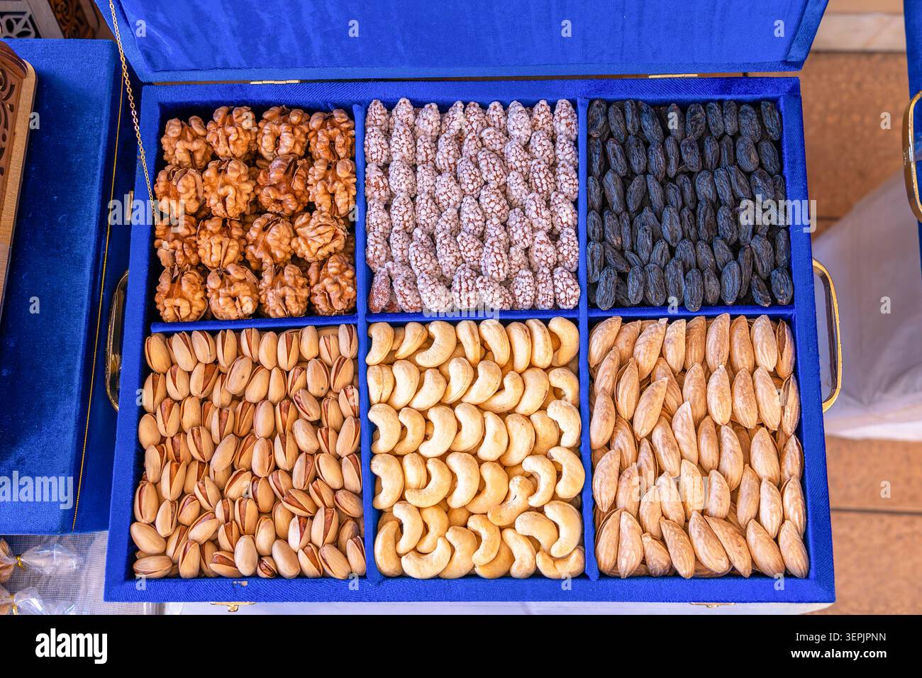 A luxurious Uzbek gift set filled with a variety of nuts and dried ...