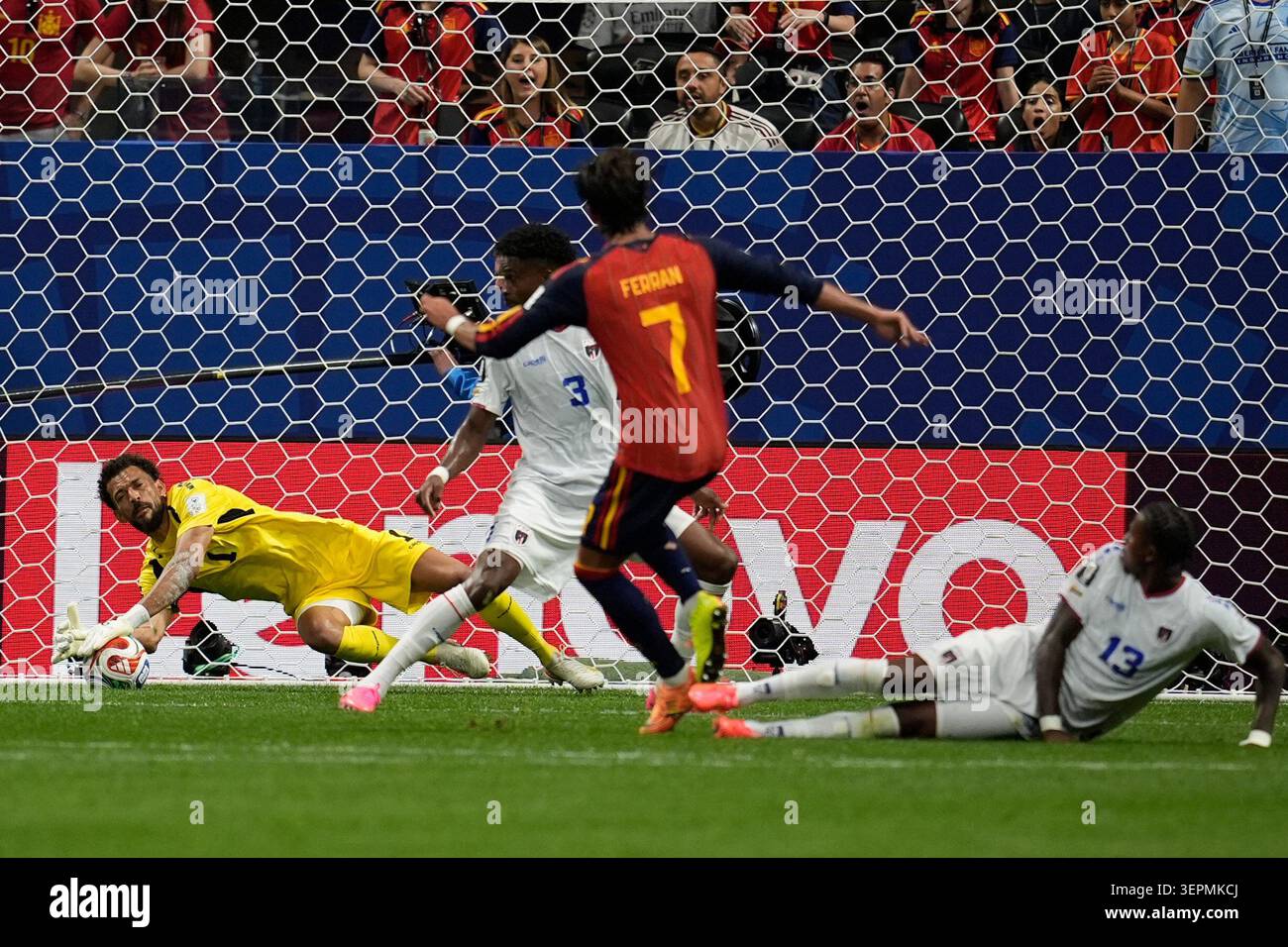 Cape Verde goalkeeper Vozinha, left, makes a save after shot by Spain's ...