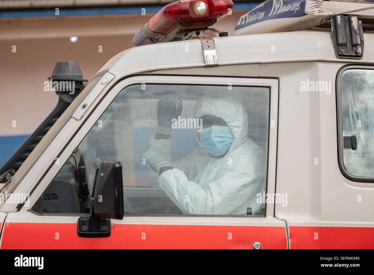 A paramedic transports a suspected Ebola case to a treatment center in ...