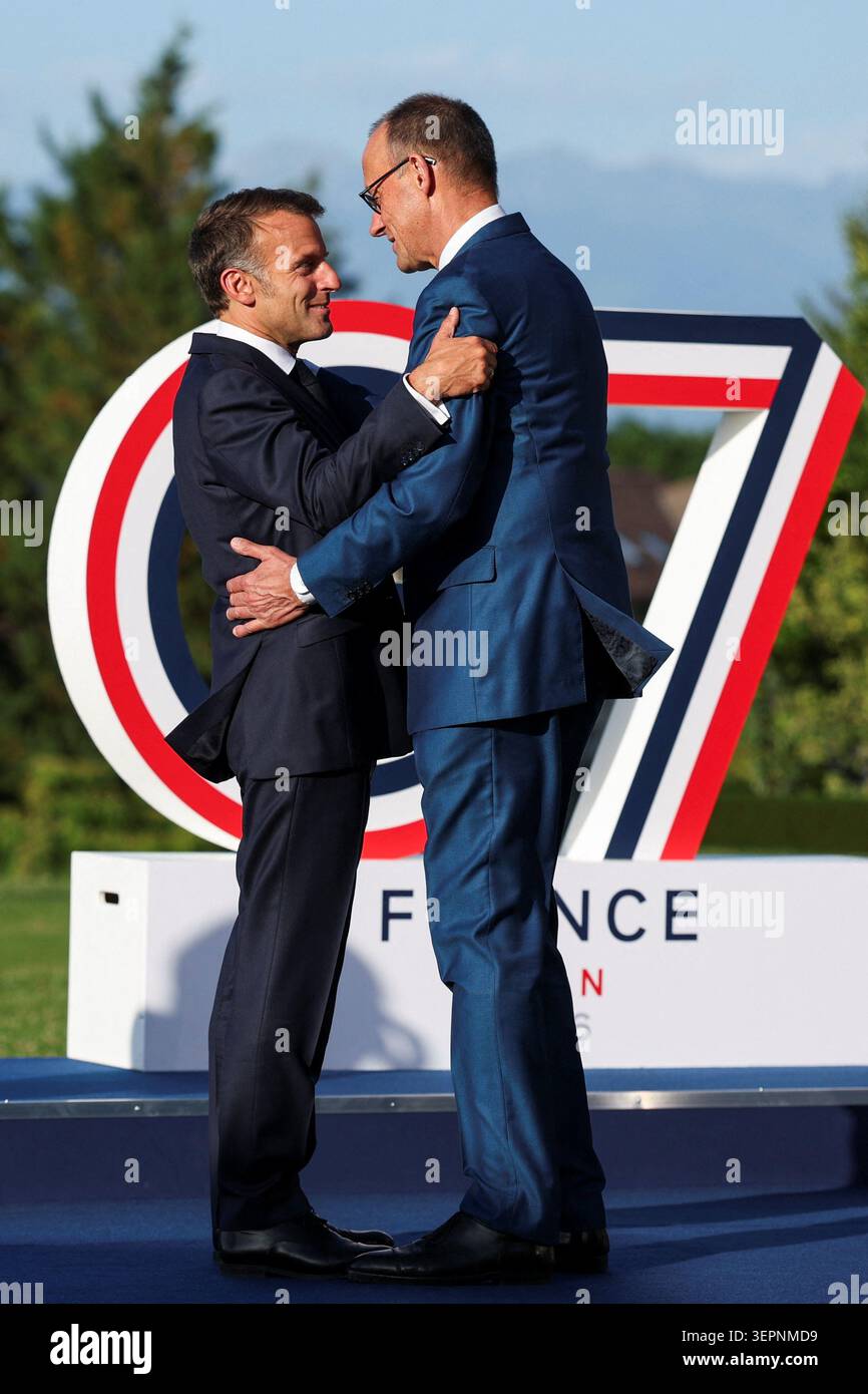 French President Emmanuel Macron greets German Chancellor Friedrich ...