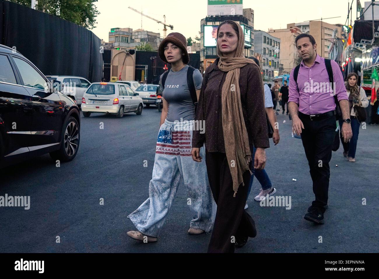 People walk along Tajrish square in northern Tehran, Monday, June 15 ...