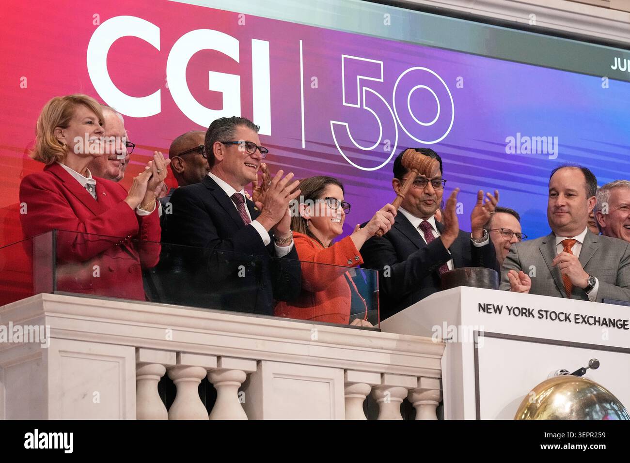 Stephanie Mango, President of CGI Federal, gavels trading closed at the ...