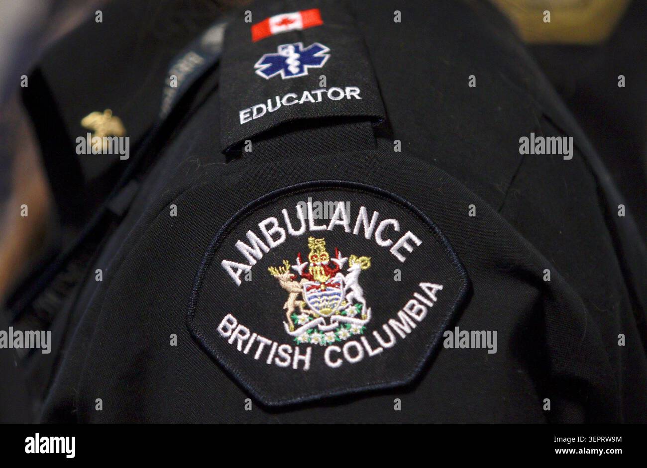 A B.C. Ambulance Service paramedic wears a uniform while at the central ...