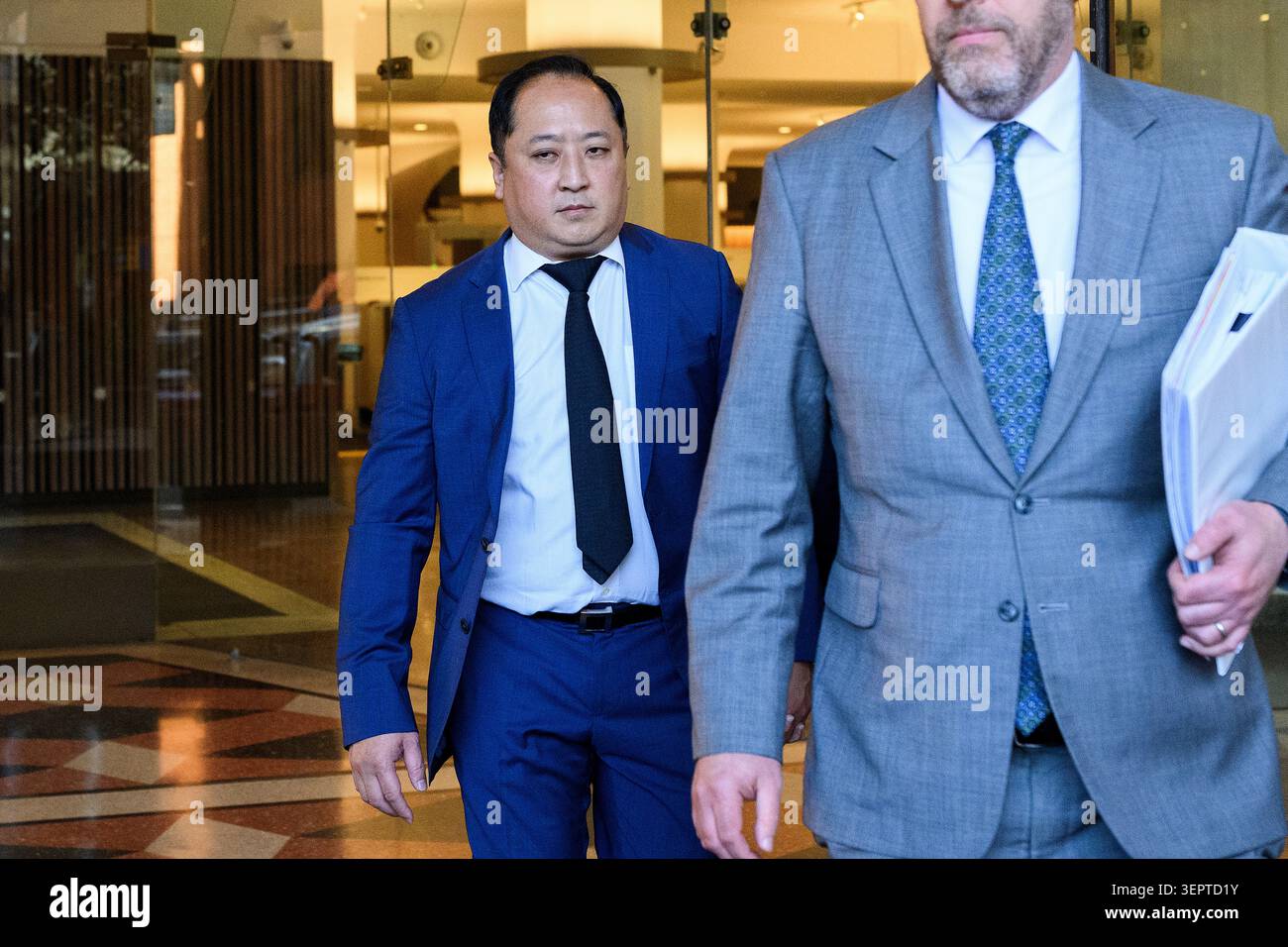 Canberra, Australia. 16th June, 2026. Jonathan Yee (left) departs the ...